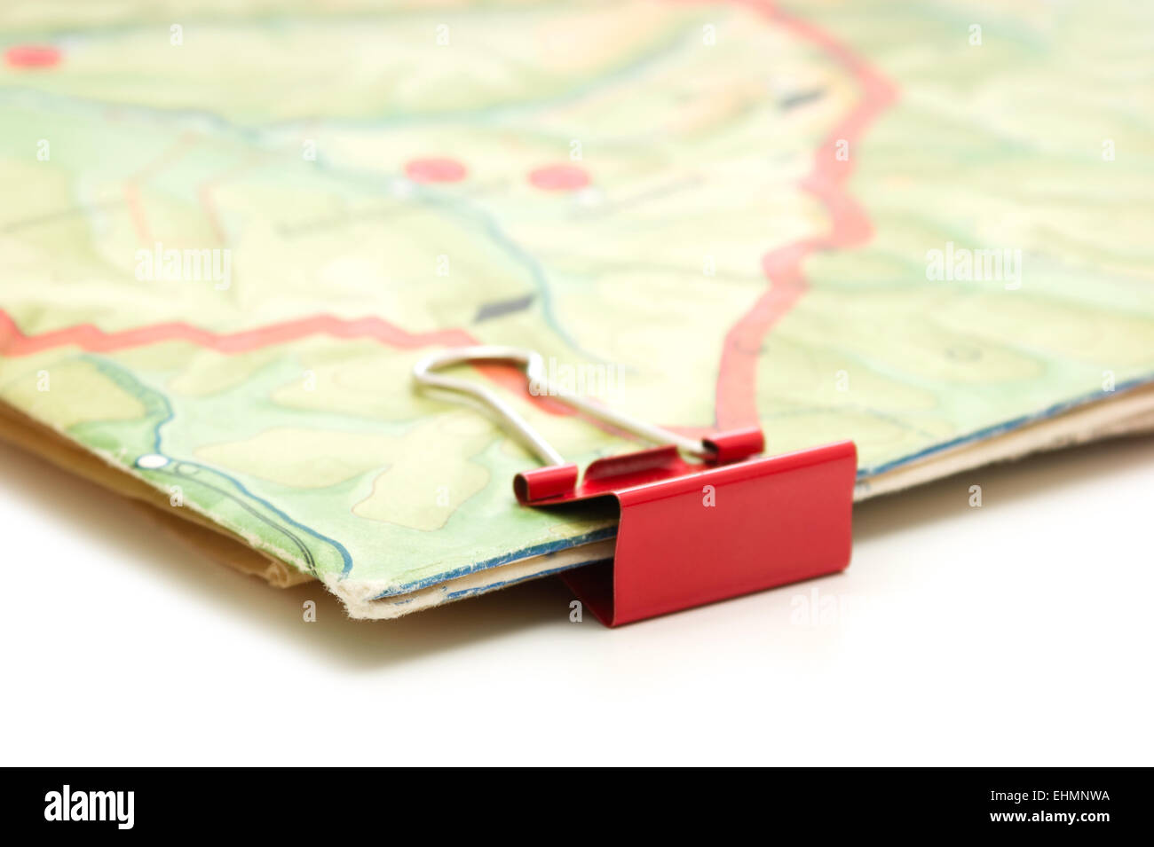 topographic map and paper clip isolated on white Stock Photo - Alamy