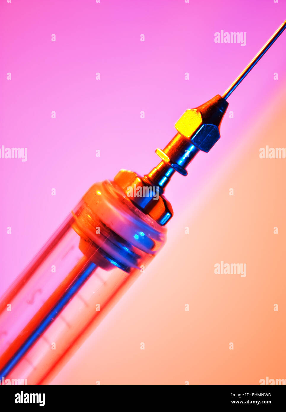 old glass syringe multicolored lights Stock Photo - Alamy