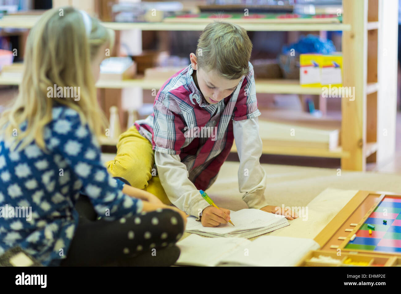 Two boys talking classroom hi-res stock photography and images - Alamy