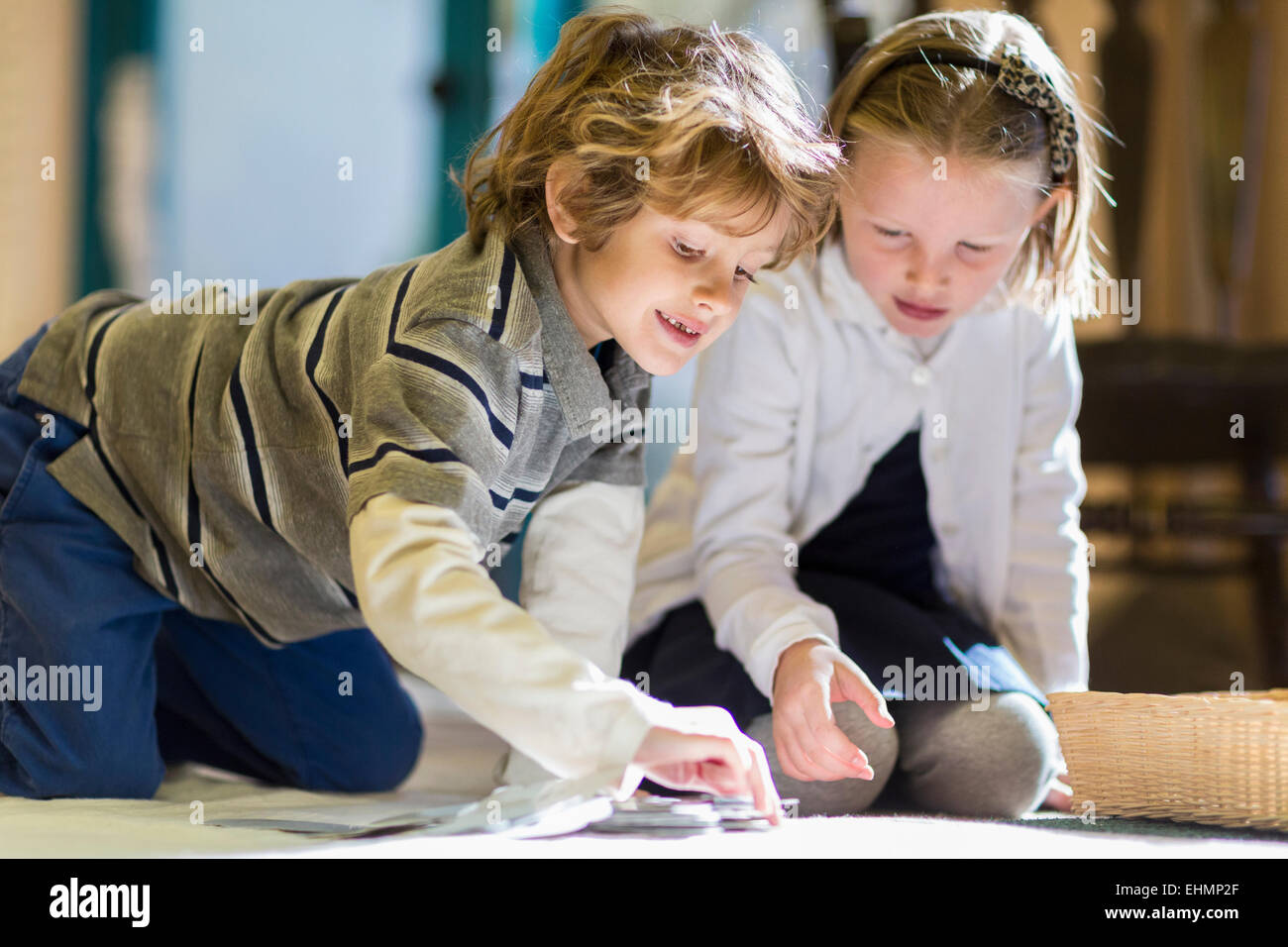 Children working together on floor in classroom Stock Photo - Alamy