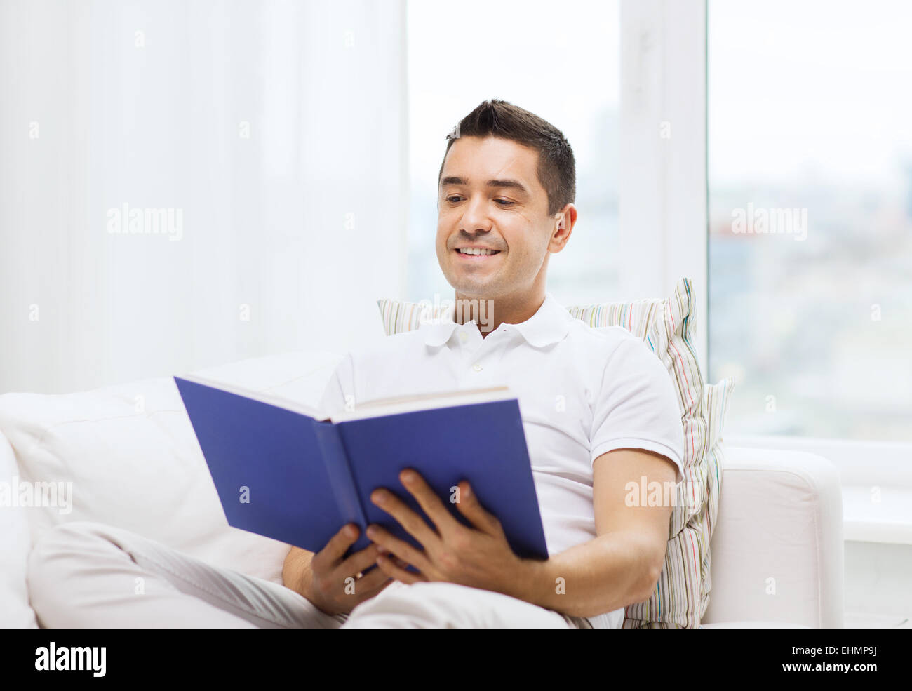 happy man reading book at home Stock Photo - Alamy happy man reading book at home Stock Photo - Alamy