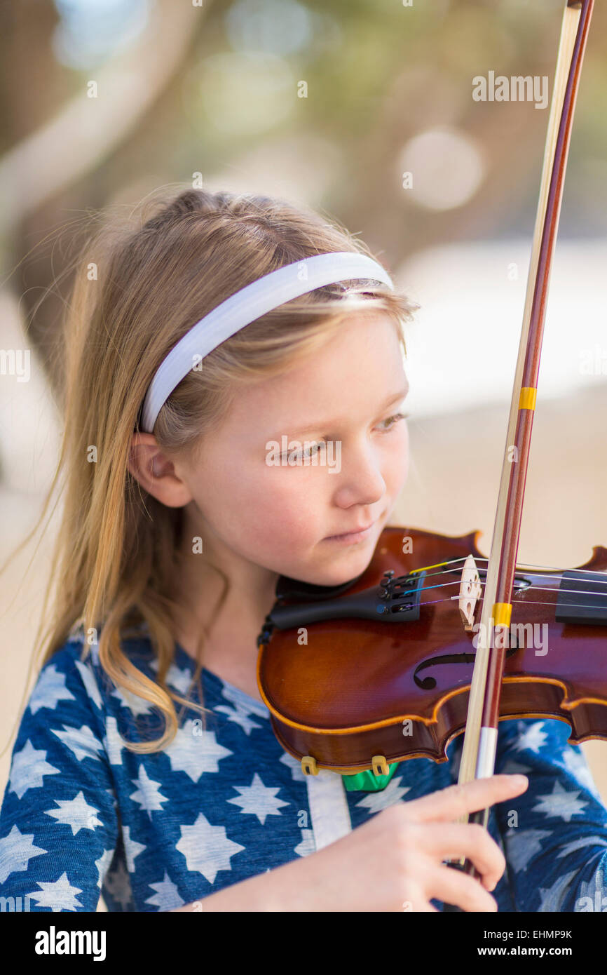 Close up of Caucasian girl playing violin Stock Photo - Alamy