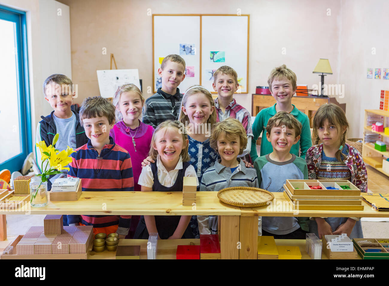 Students smiling together in classroom Stock Photo - Alamy