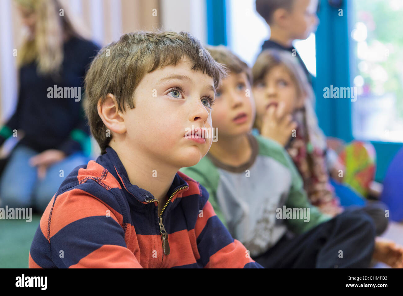 Children sitting and listening in classroom Stock Photo - Alamy