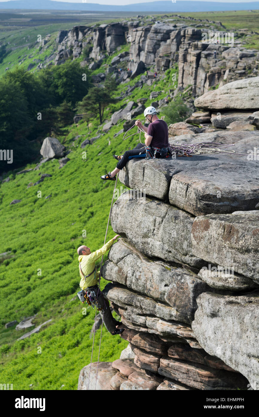 Climbers on Stanage Edge in the Peak District Park Derbyshire Stock ...