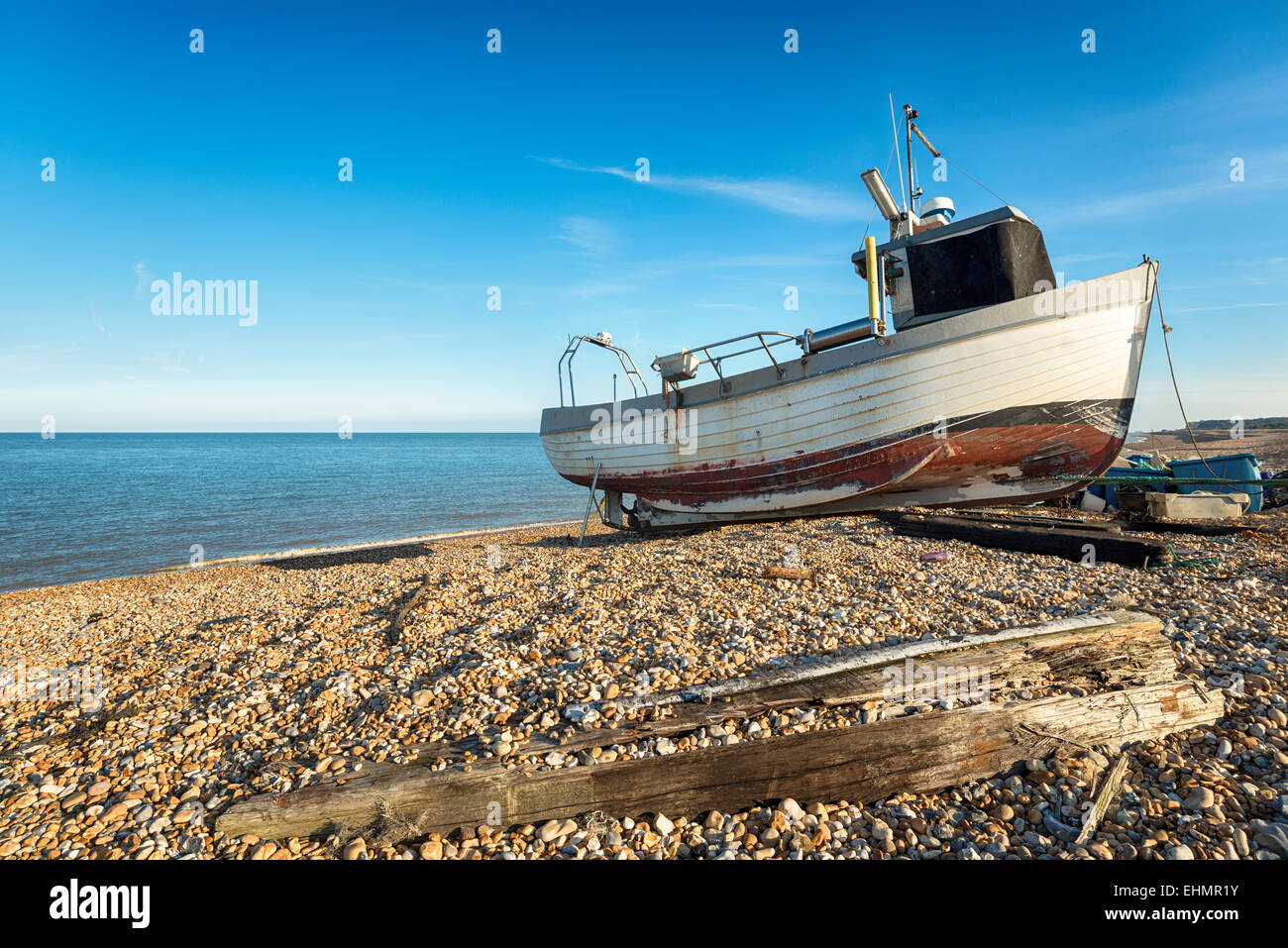 Pebble beach with a boat hi-res stock photography and images - Alamy
