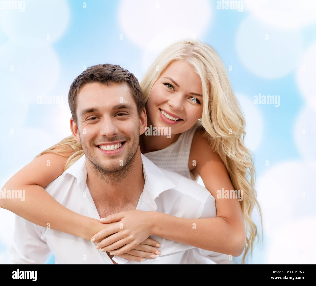 couple having fun over blue lights background Stock Photo - Alamy
