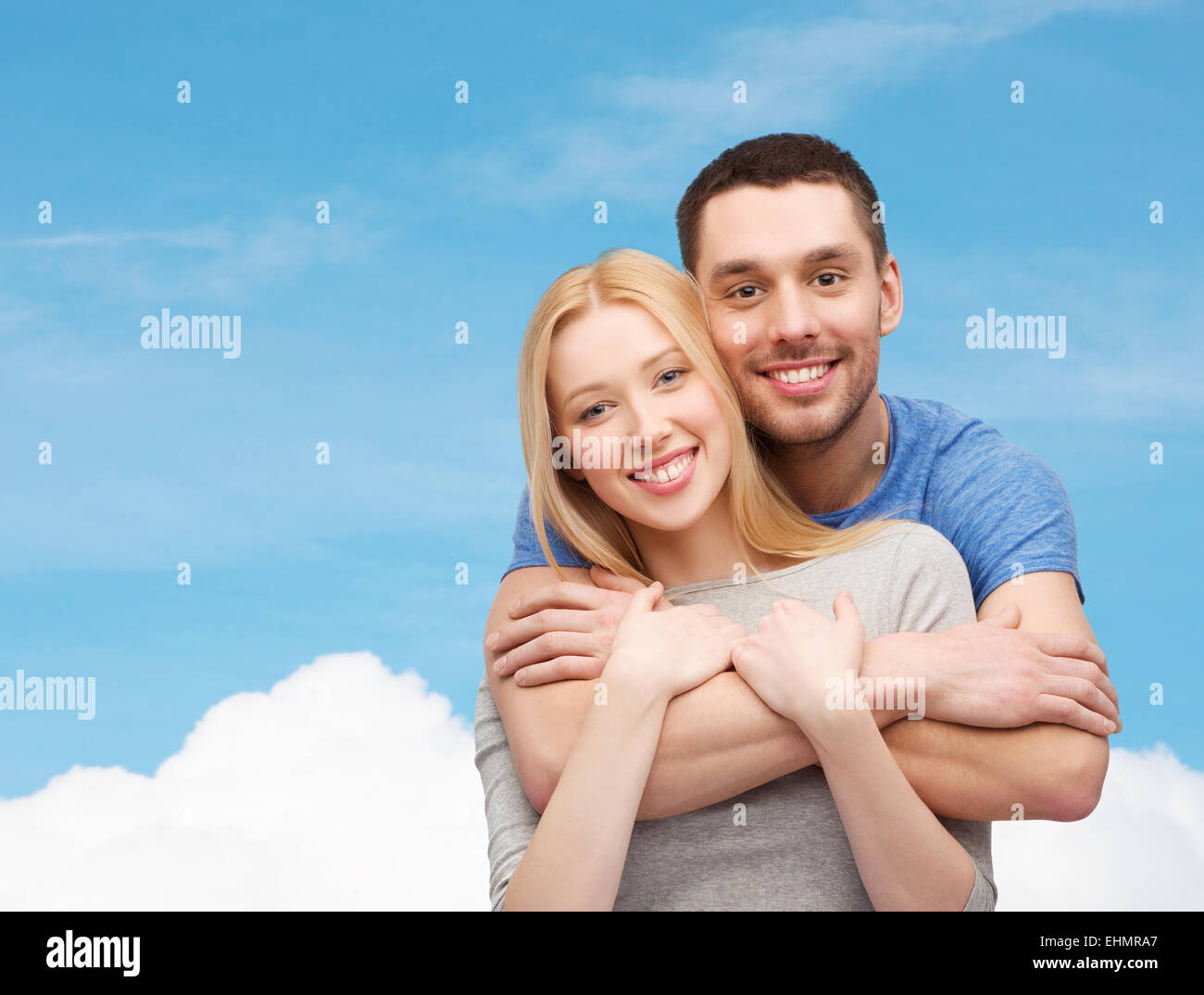 smiling couple hugging Stock Photo - Alamy