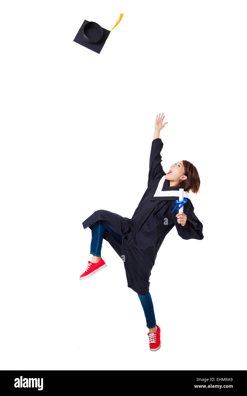 Happy female student in graduate robe dancing Stock Photo - Alamy