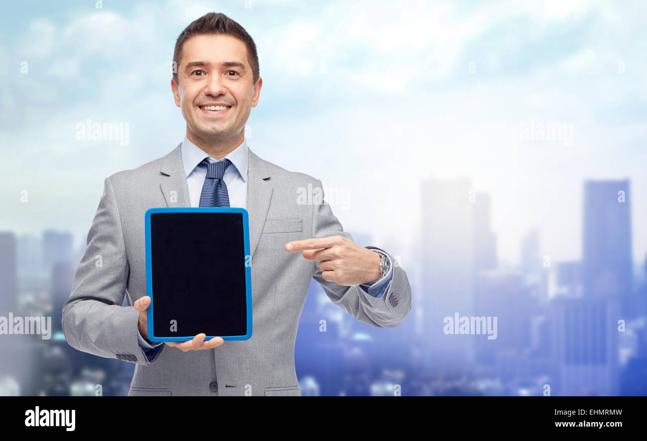 Happy businessman showing computer hi-res stock photography and images ...
