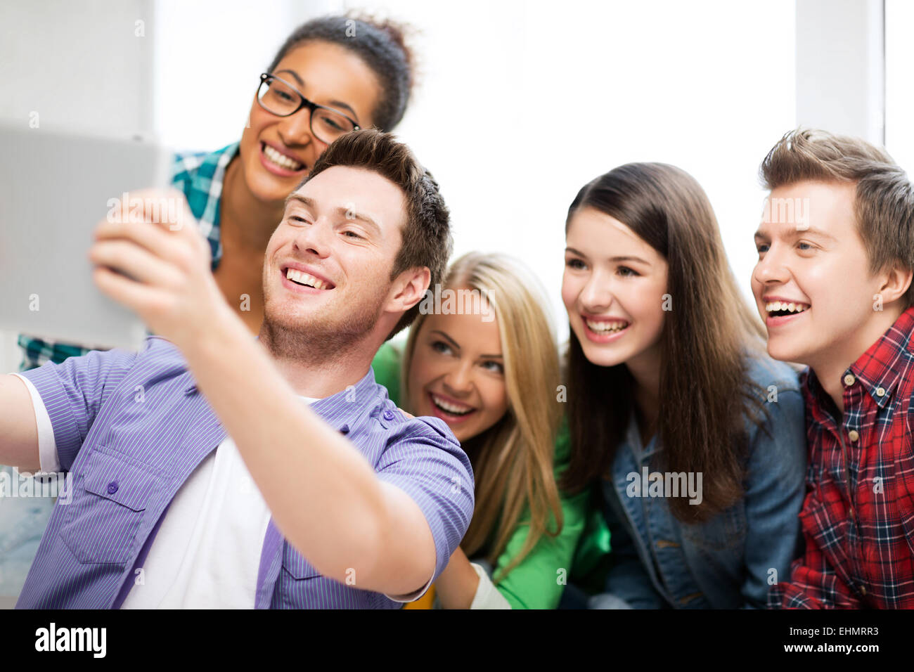 students taking selfie with tablet pc at school Stock Photo - Alamy