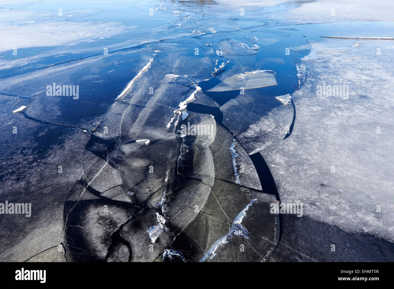 cracking ice on lake, Finland Stock Photo - Alamy