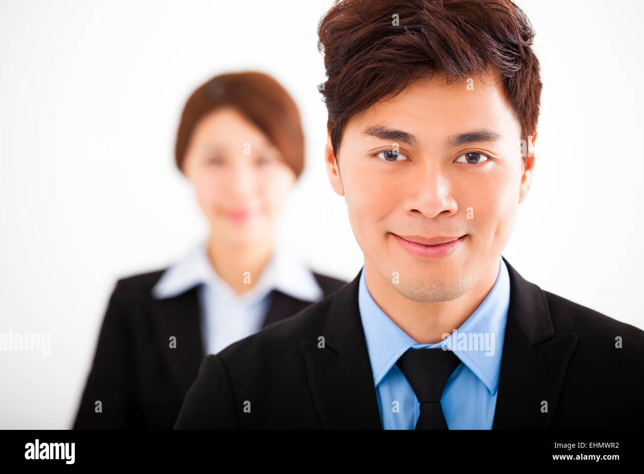 Handsome happy business man with colleagues Stock Photo - Alamy