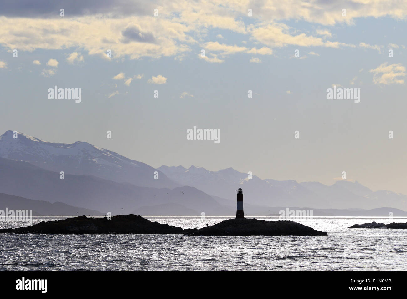 Lighthouse marks the way during sunset sky in Beagle Channel, Argentina ...