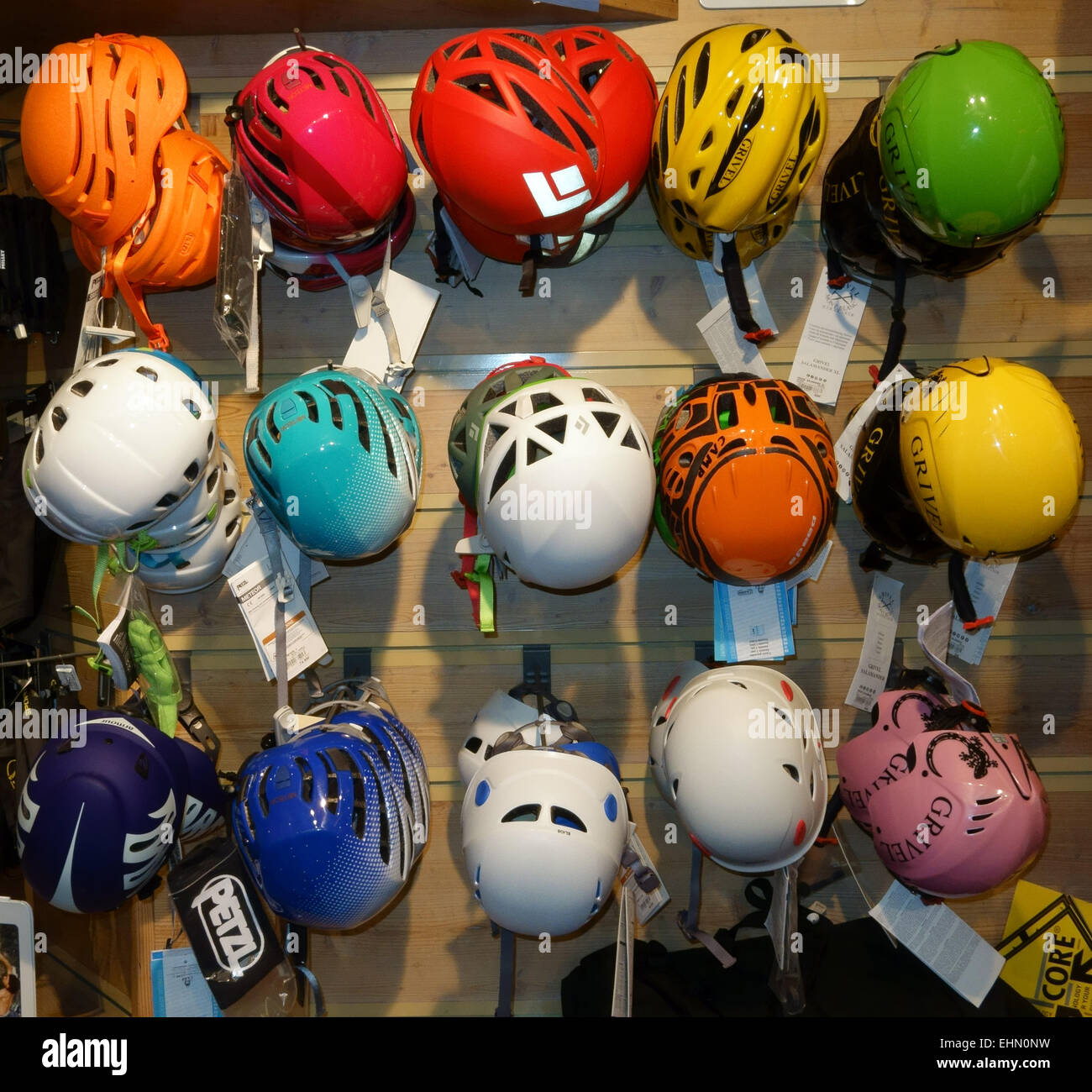 Climbing helmets colouful colorful display Stock Photo - Alamy