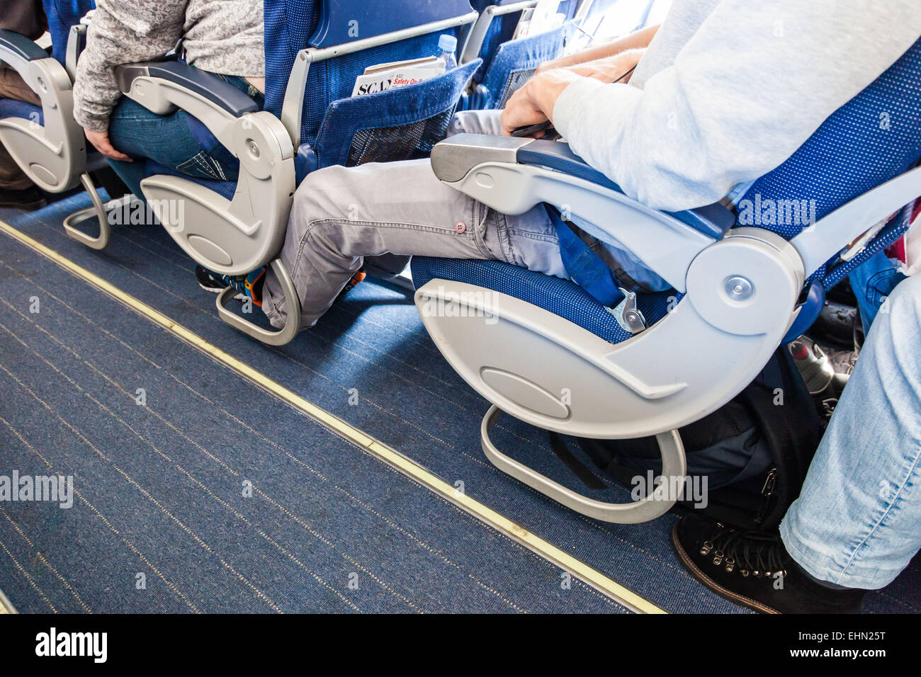 Economy class seating on plane Stock Photo - Alamy