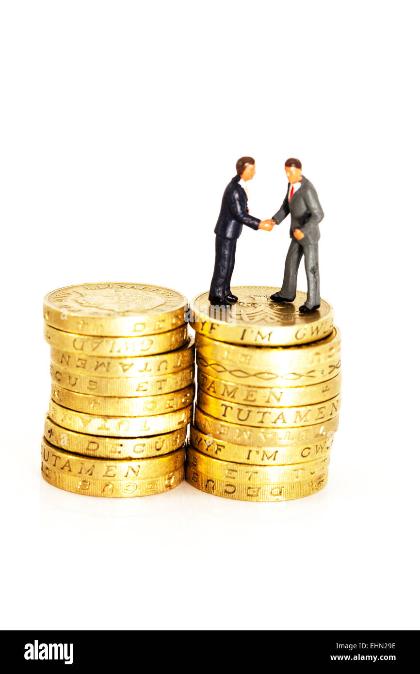 money deal business budget UK pound coins stacks businessmen isolated ...