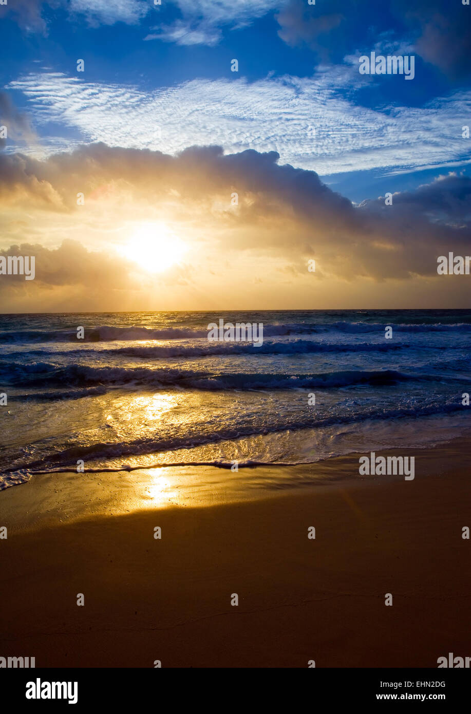 A beach during a sunset Stock Photo - Alamy