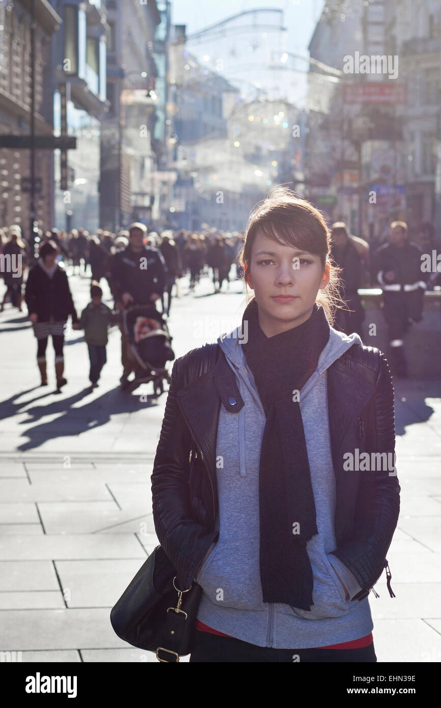 Urban girl standing out from the crowd at a city street Stock Photo - Alamy