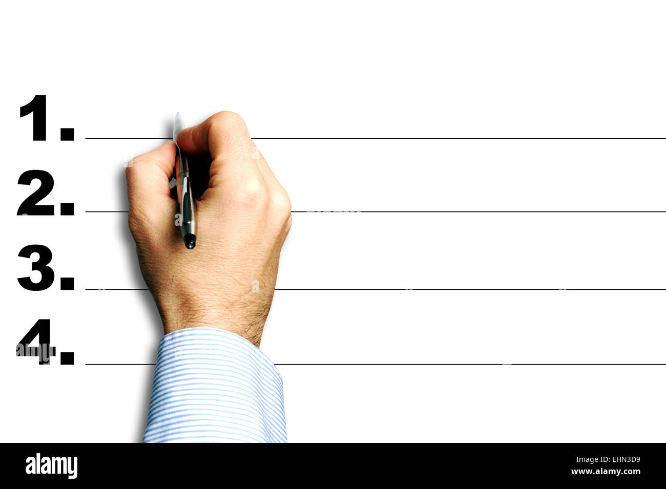 hand in process of writing notes on a numbered list Stock Photo - Alamy