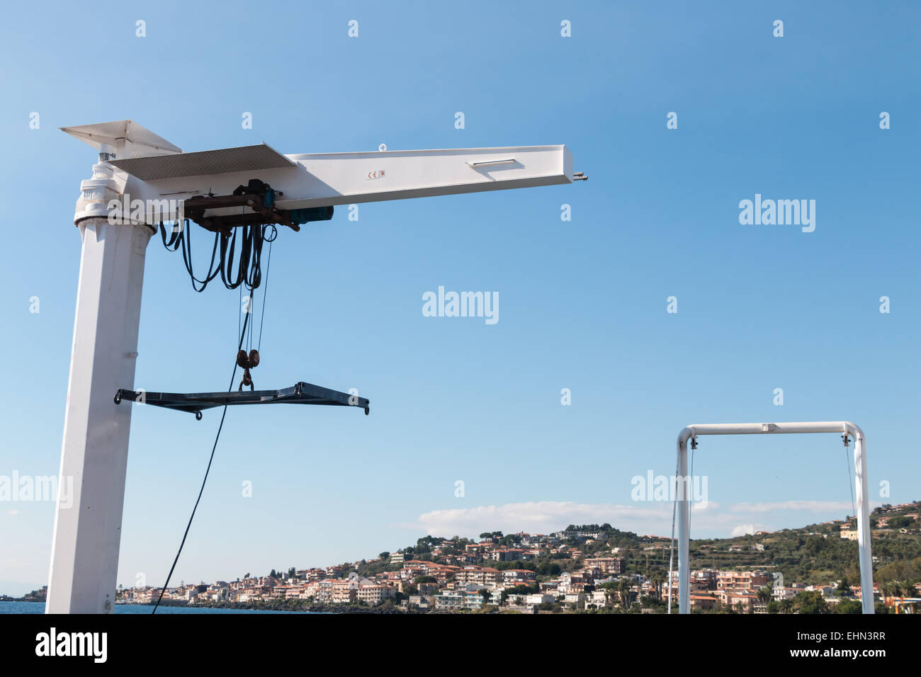 Davit on the dock ready to lift a boat Stock Photo - Alamy