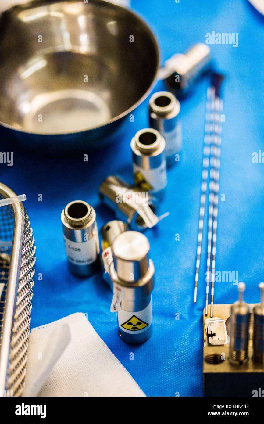 Prostate cancer radiotherapy surgery. Radiologist inserting a hollow ...