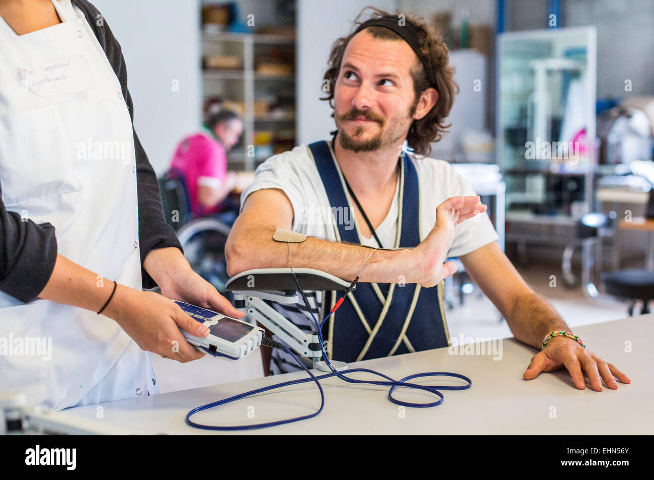 Hemiplegic patient after a stroke, and occupational therapist during an ...