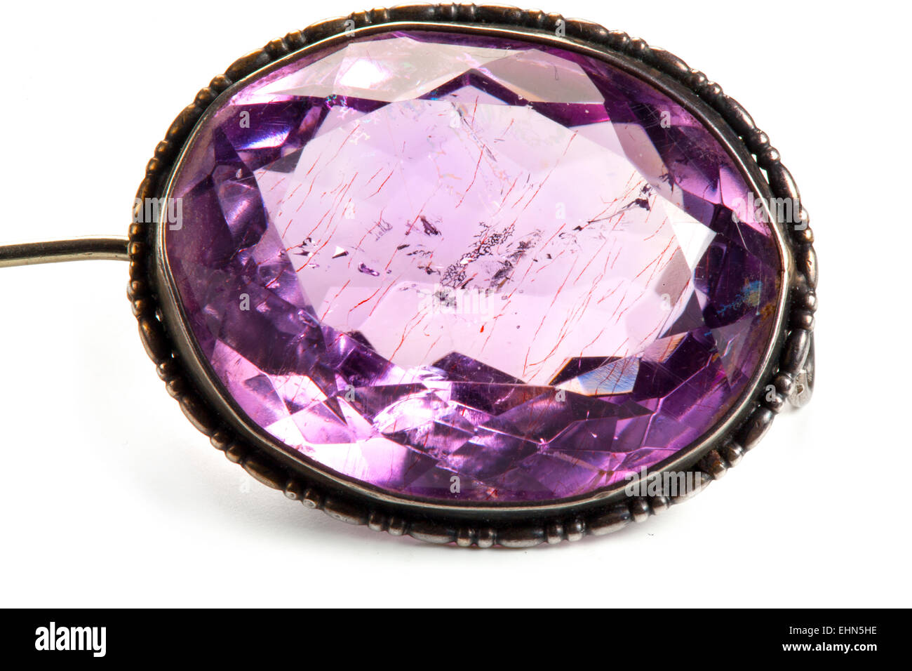 Amethyst stone with intriguing red thread-like crystal inclusions Stock ...