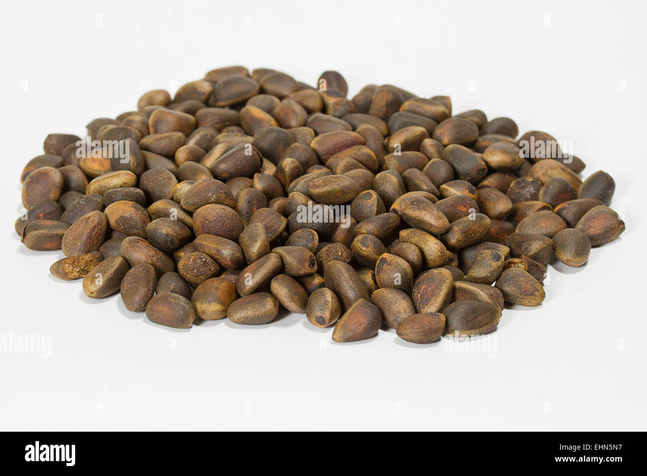 Cedar nuts isolated on white background Stock Photo - Alamy