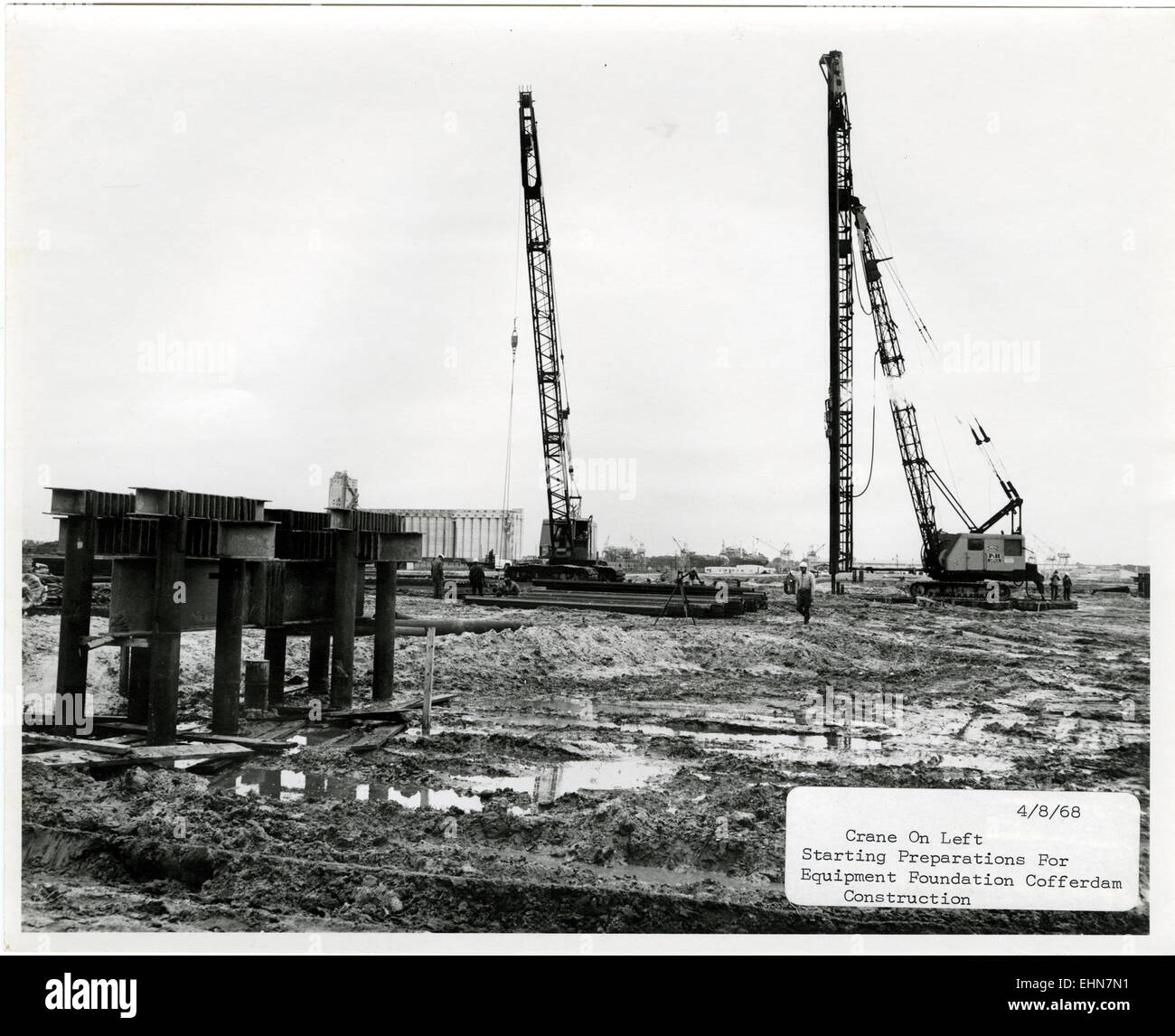 This image shows a crane on the left beginning preparations for the ...