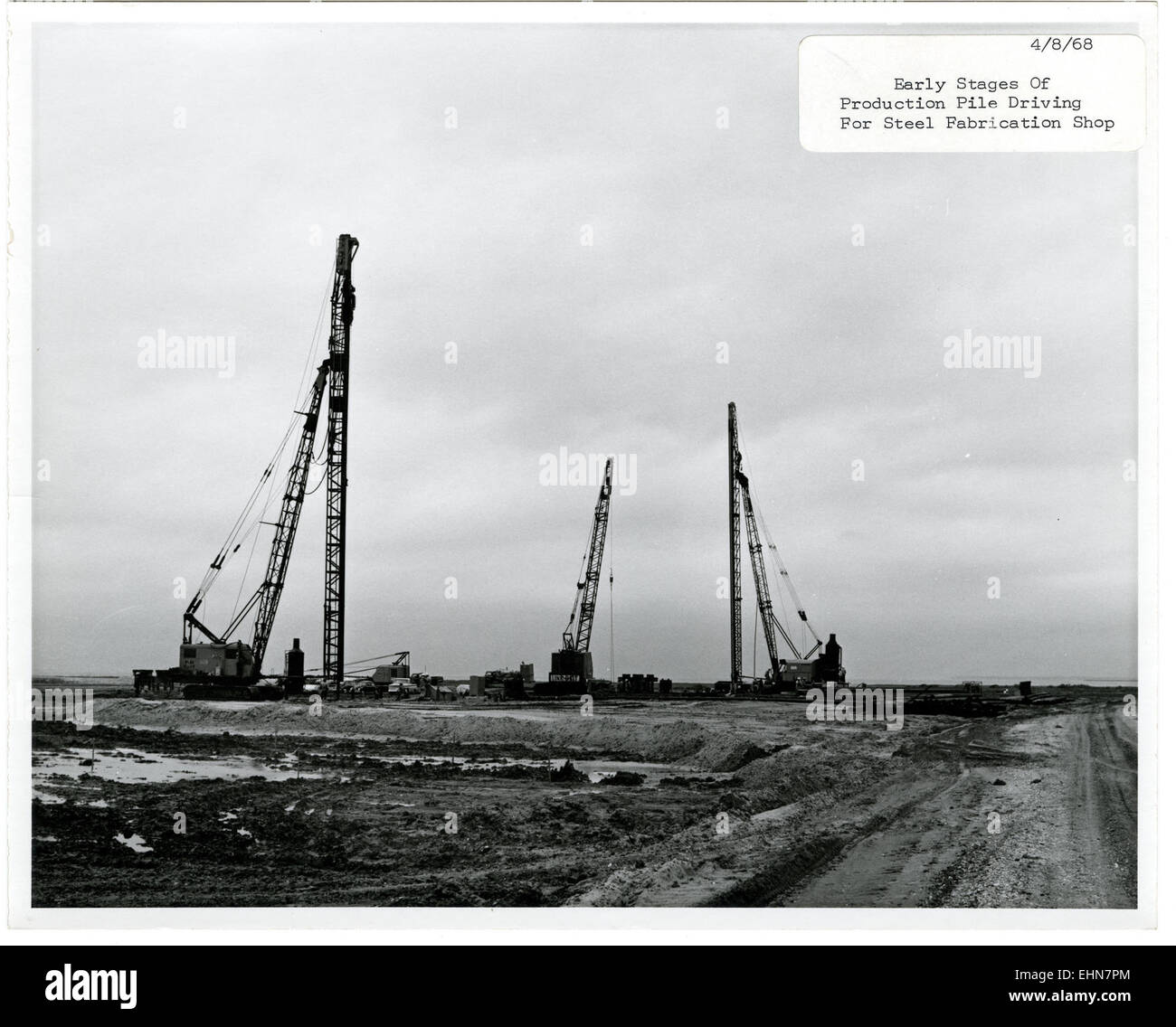 The image shows the early stages of pile driving at a steel fabrication ...