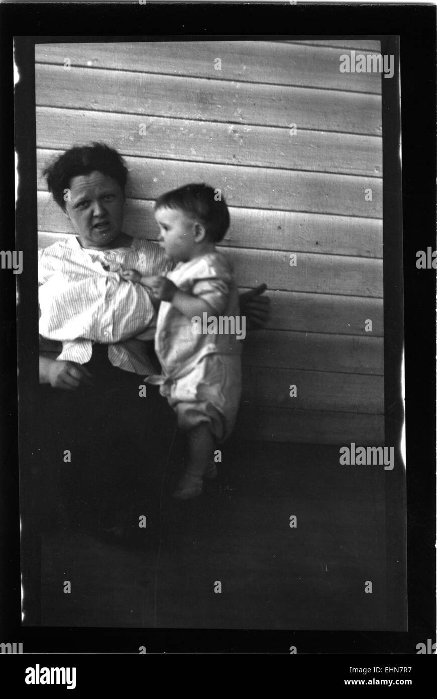 This photograph captures the tender moment of Lula Ulrich holding her ...