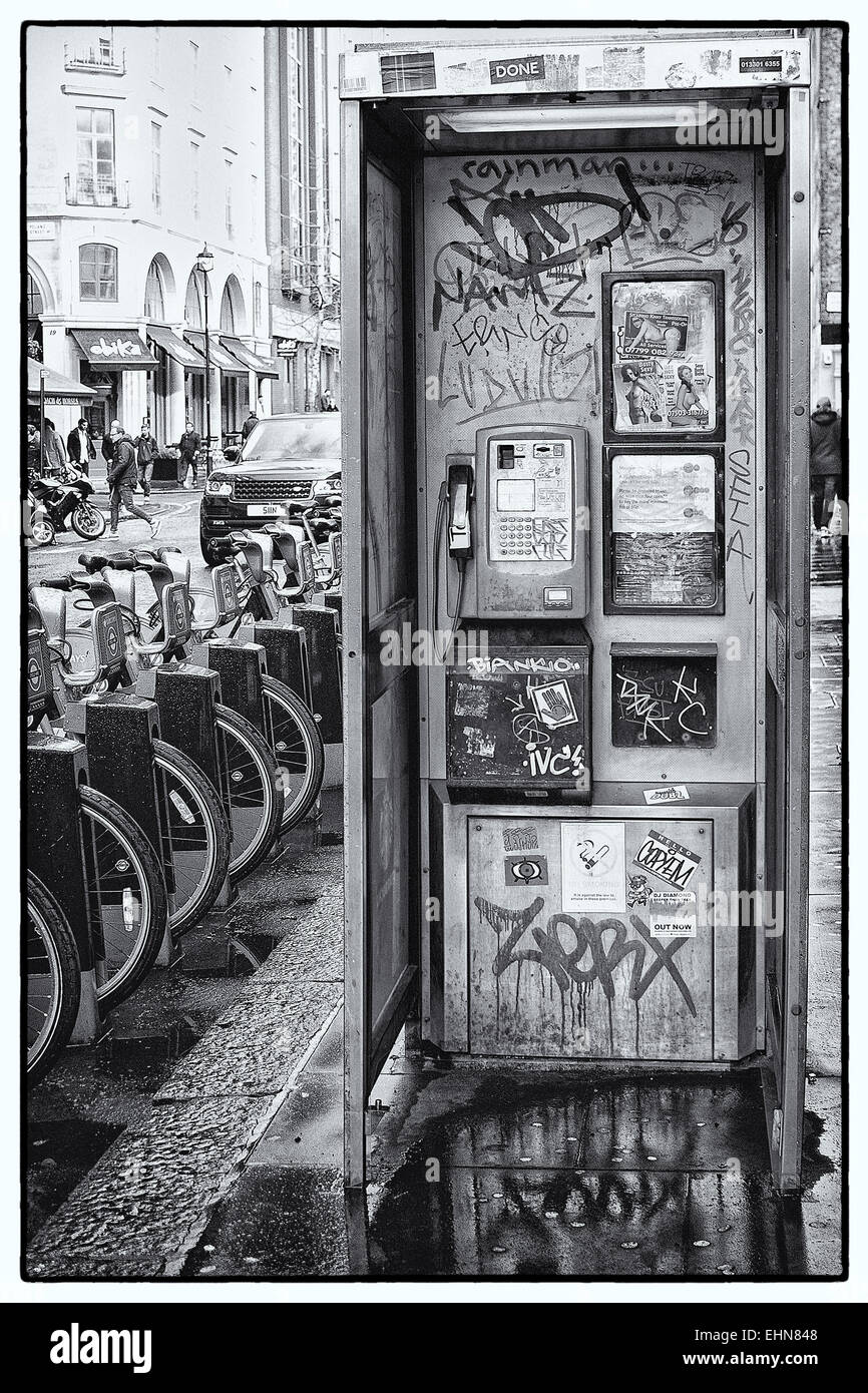 Telephone Box with Graffiti in Soho, London Stock Photo - Alamy