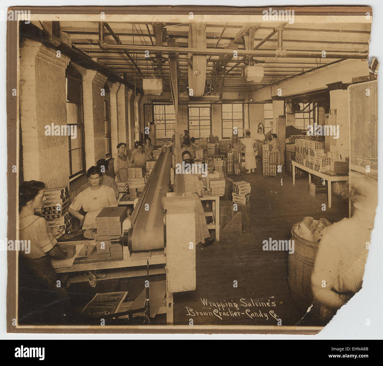 The image shows workers wrapping Saltine crackers at Brown Cracker and ...
