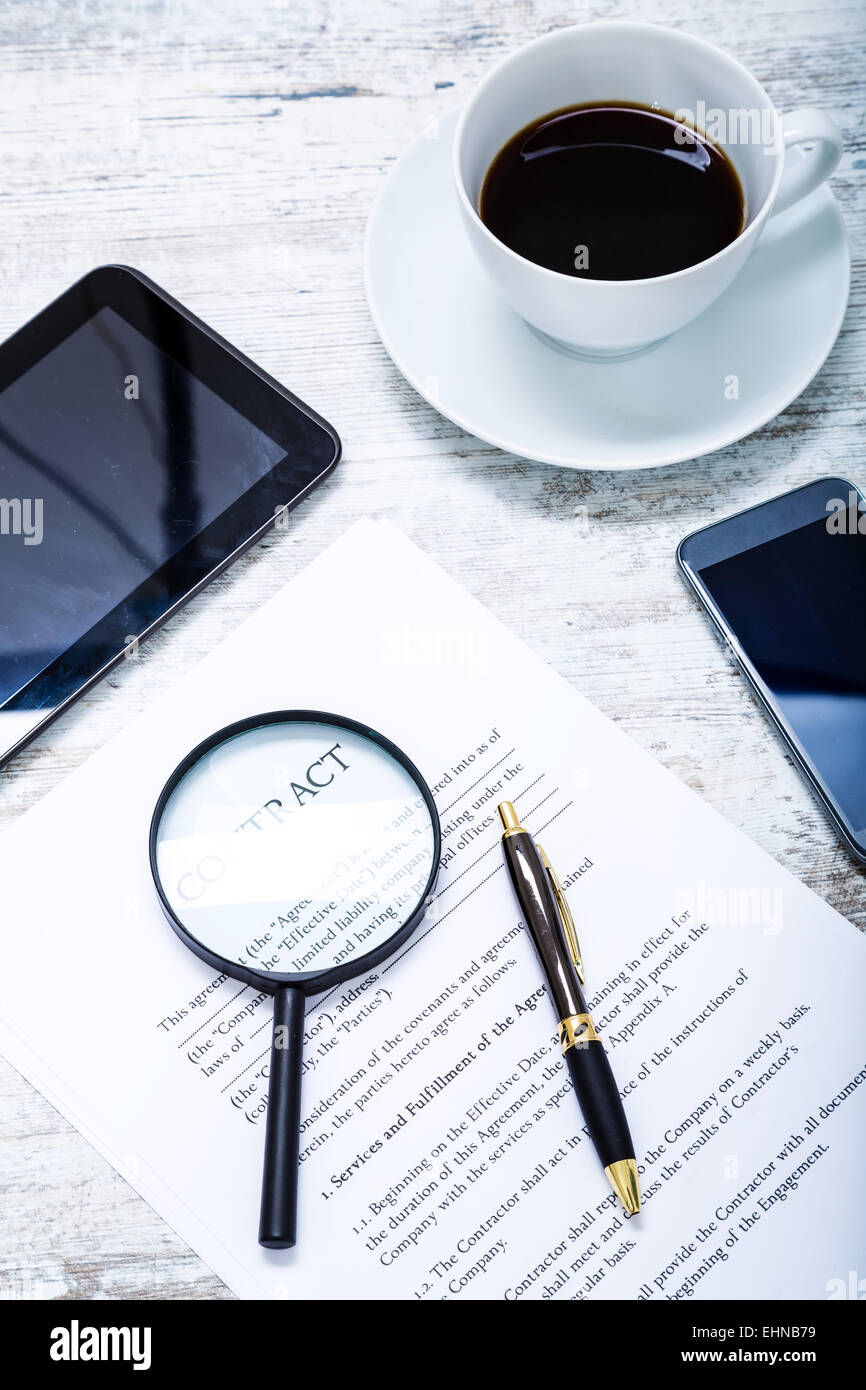 Reading a Contract before signing Stock Photo - Alamy