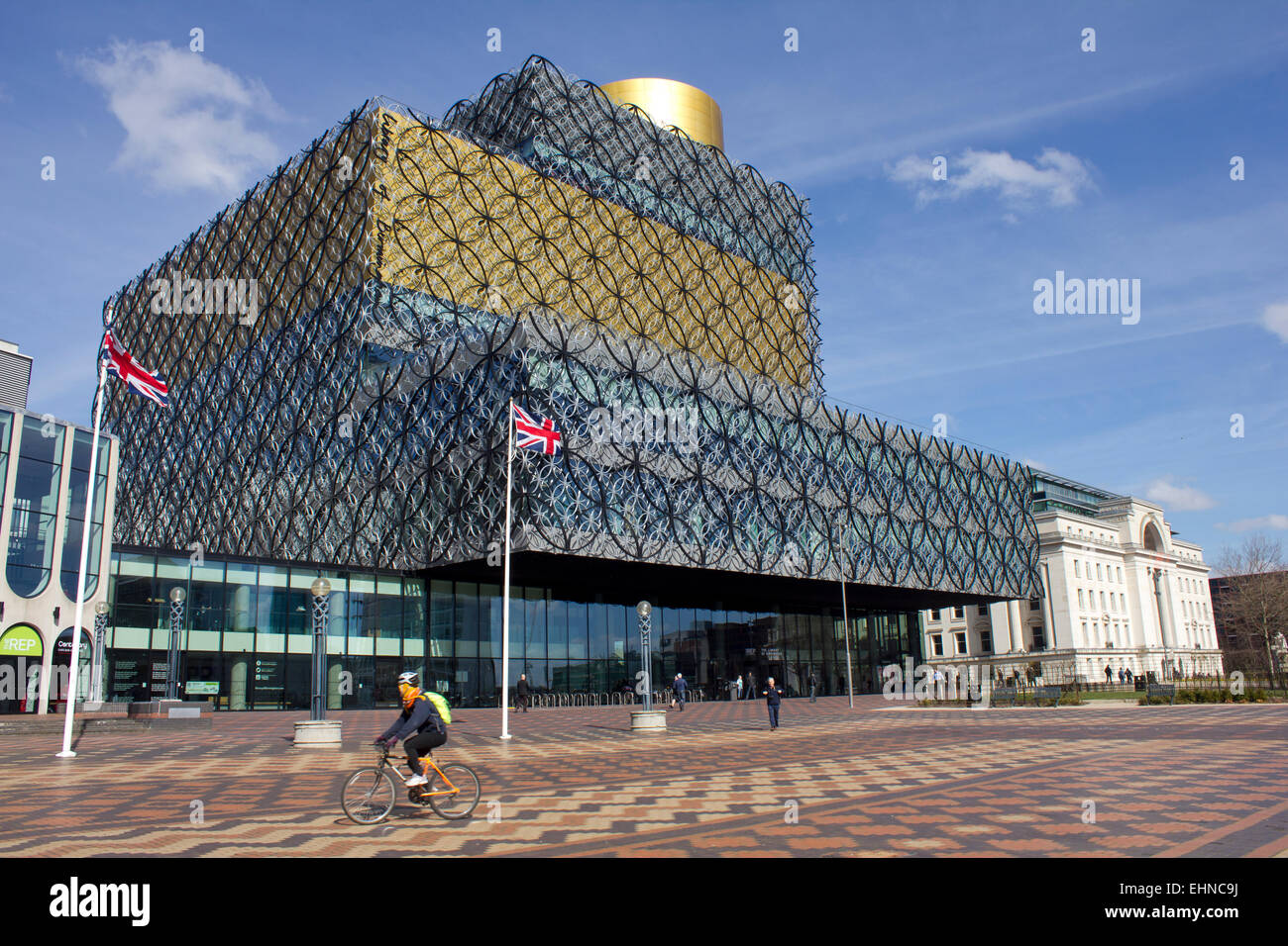 Birmingham Library, Centenary Square, Birmingham, England; a cyclist ...