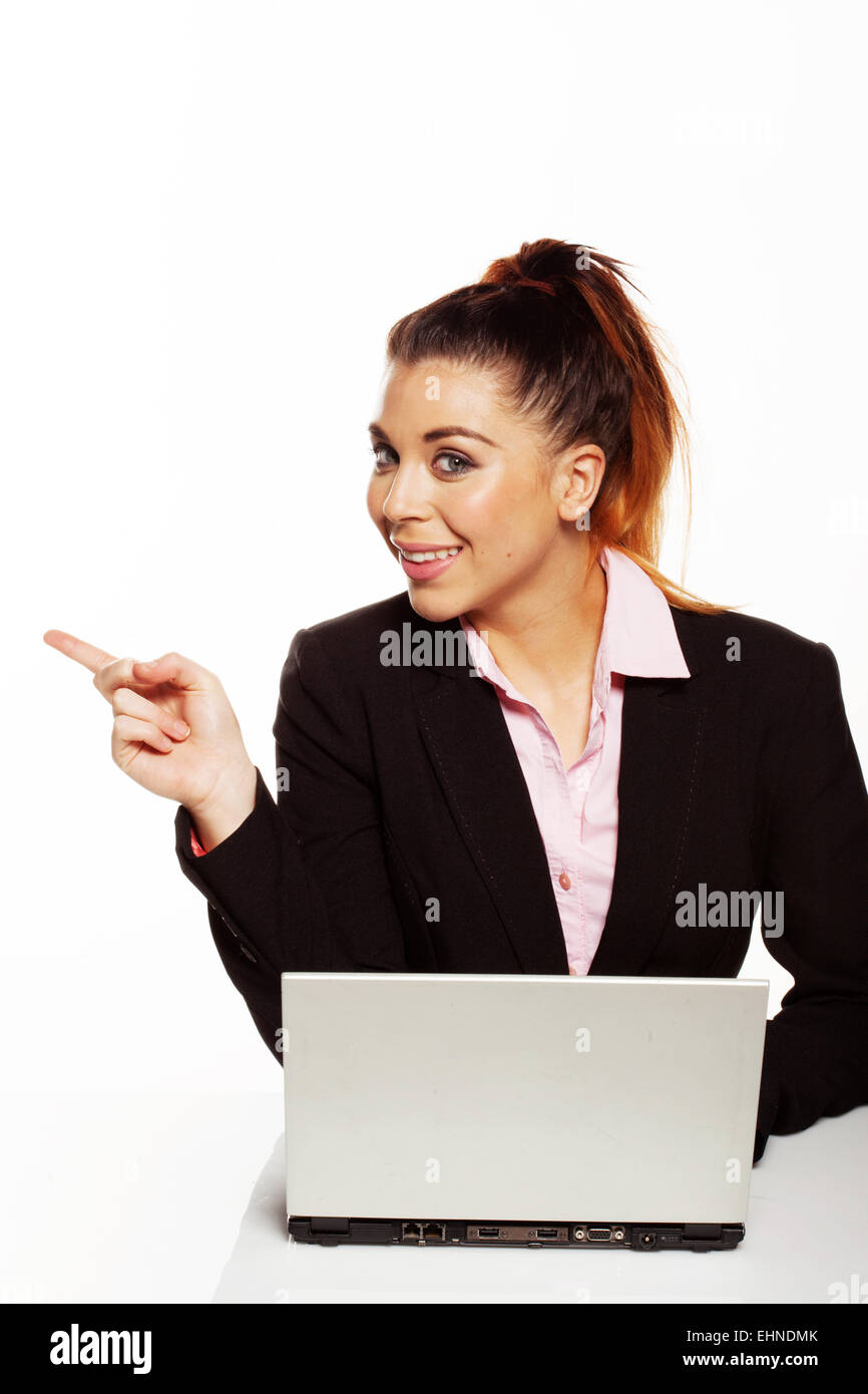 Businesswoman pointing off frame Stock Photo - Alamy