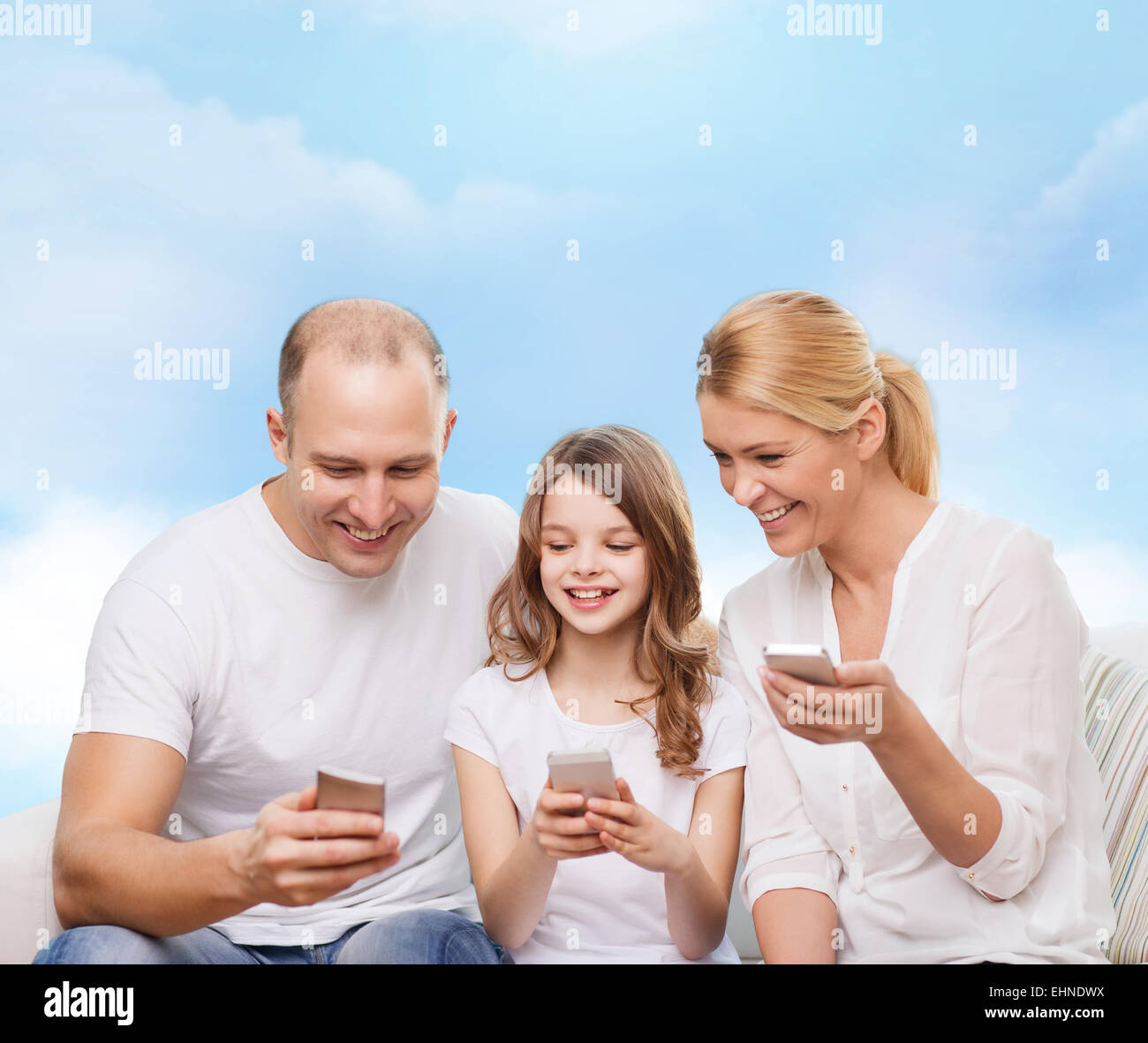 happy family with smartphones Stock Photo - Alamy