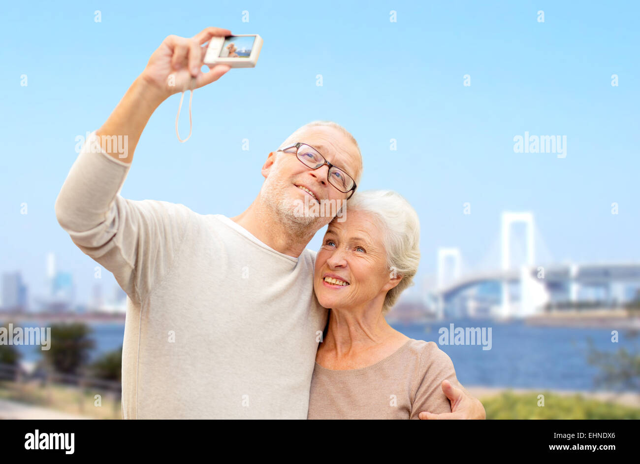 senior couple with camera over rainbow bridge Stock Photo - Alamy