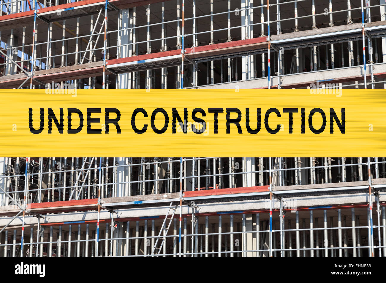 under construction writing, background scaffold Stock Photo - Alamy