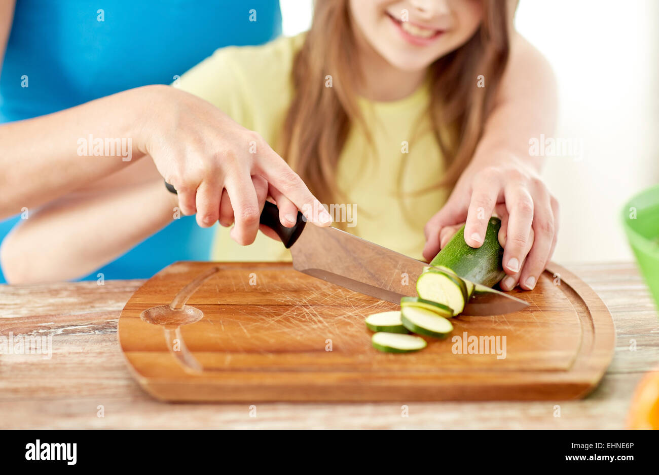 close up of happy family making dinner in kitchen Stock Photo - Alamy