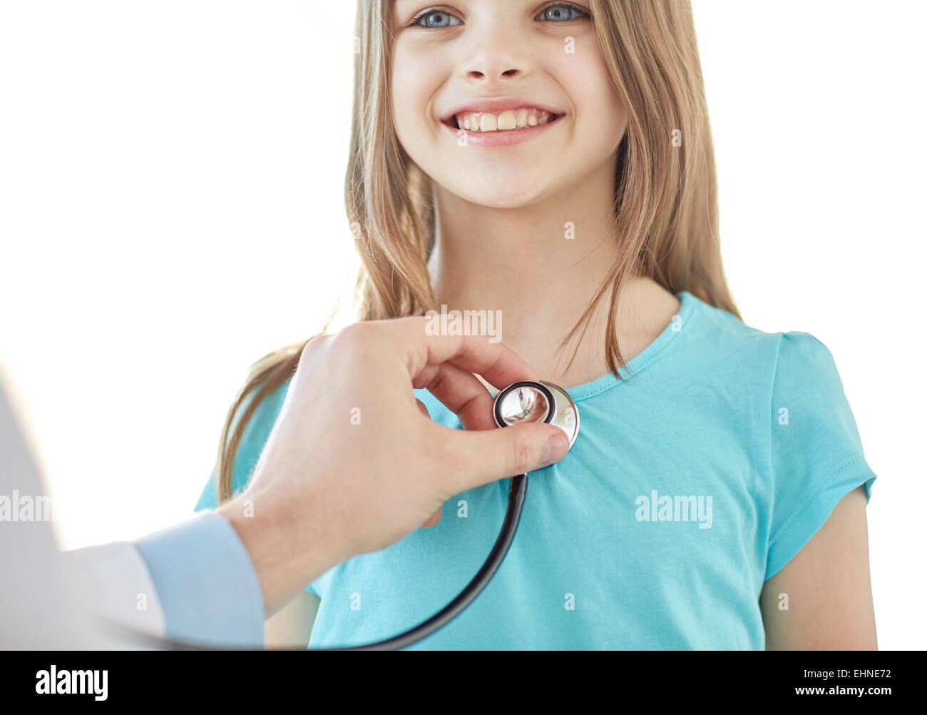 close up of happy girl and doctor on medical exam Stock Photo - Alamy