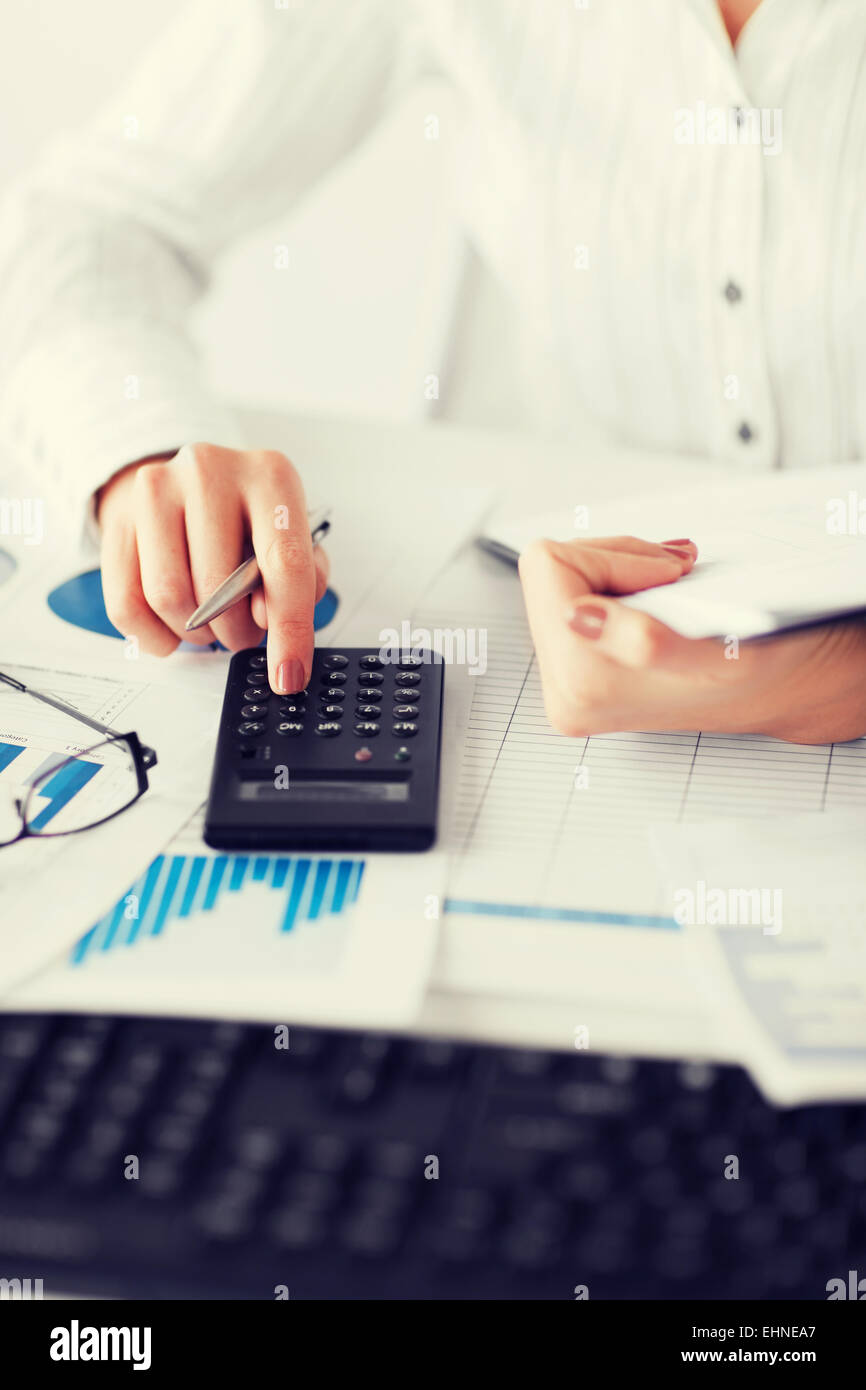 woman hand with calculator and papers Stock Photo - Alamy
