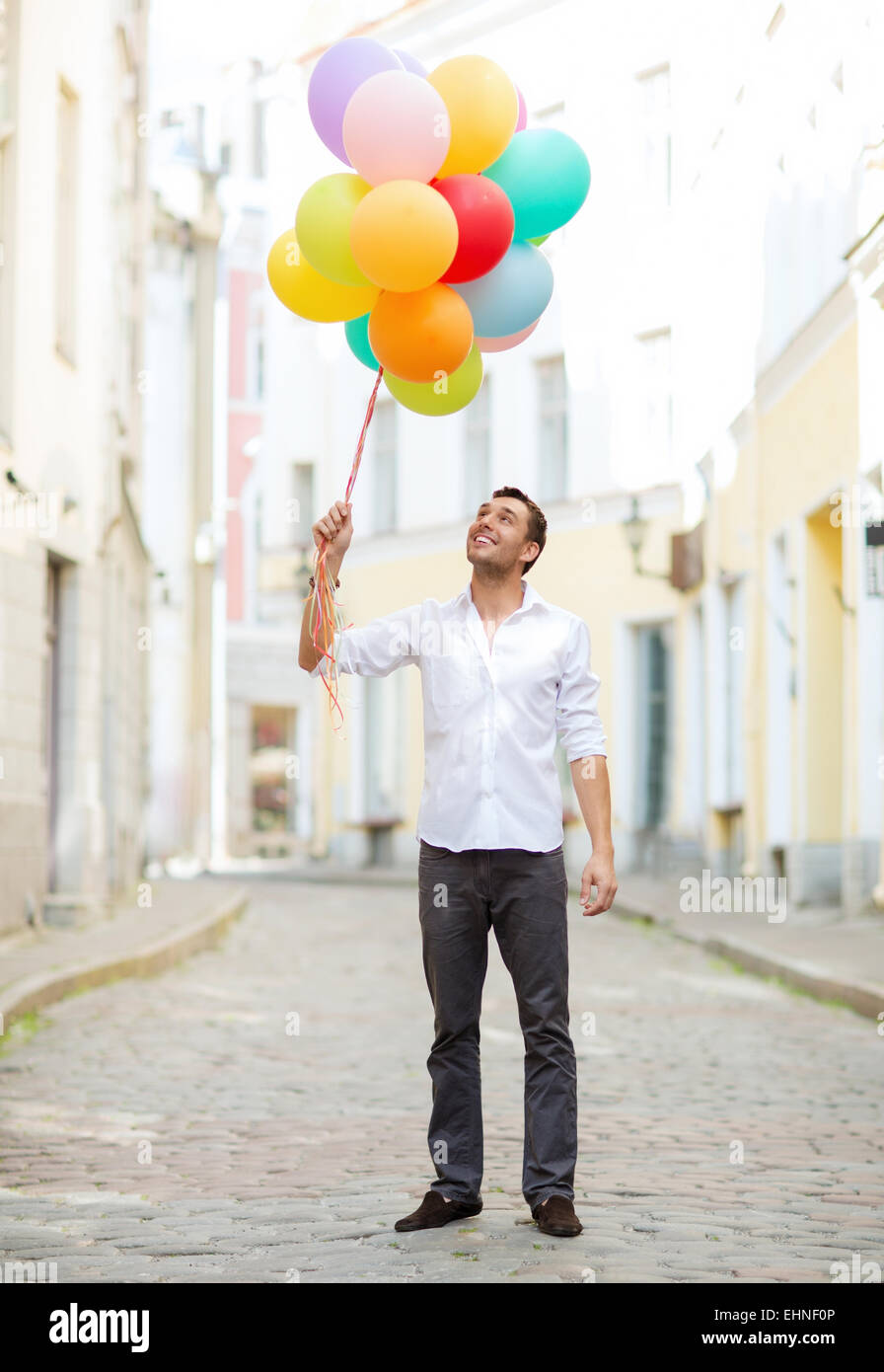 man with colorful balloons in the city Stock Photo - Alamy