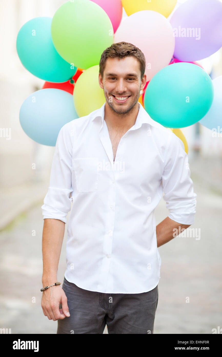 Man flying helium balloons hi-res stock photography and images - Alamy