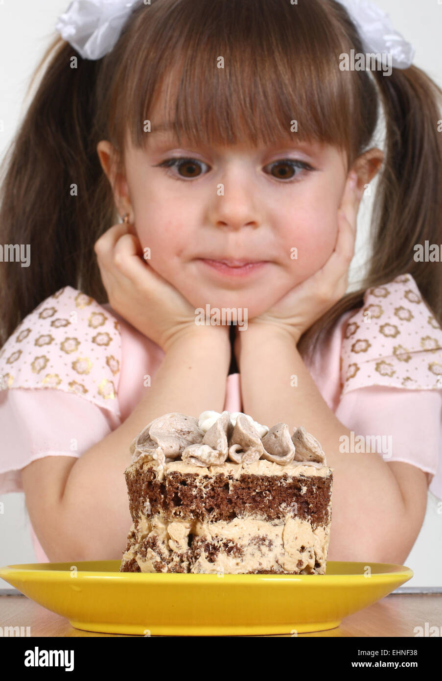 Child girl and cake, focus on cake Stock Photo - Alamy