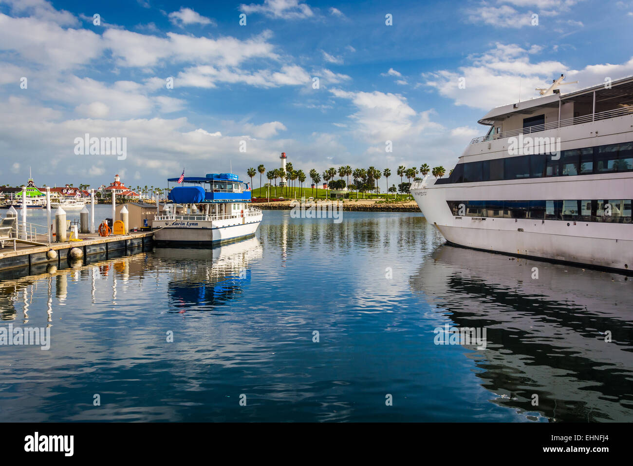 Boats and clouds reflecting in the harbor in Long Beach, California ...