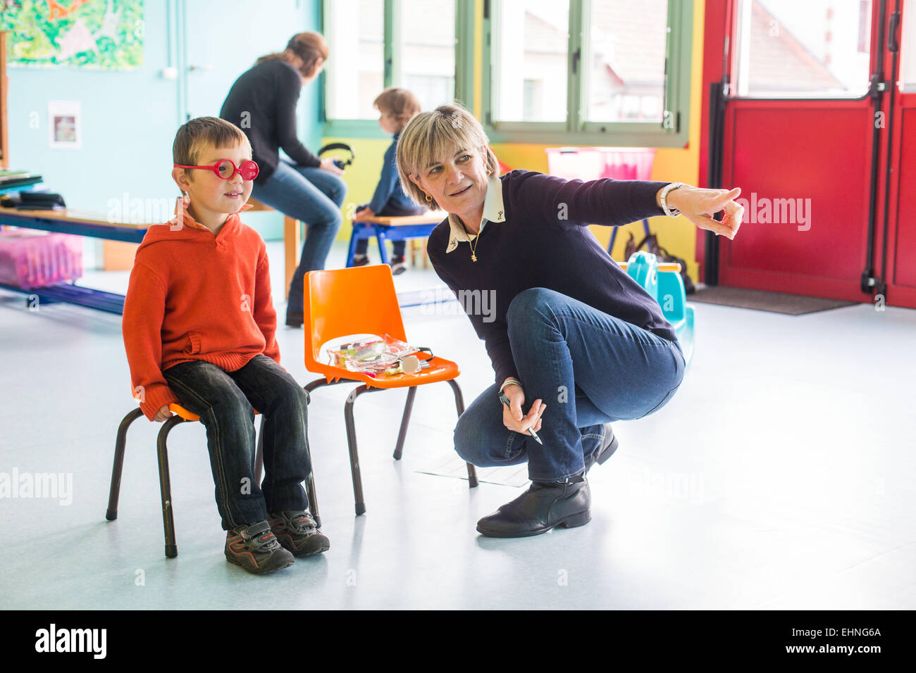 Medical check-up performed by a pediatric nurse of MCW in infant school ...