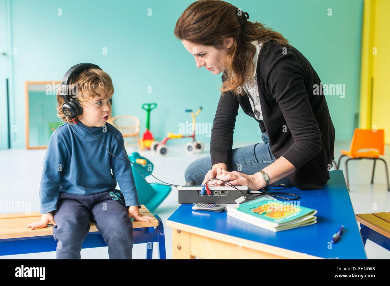 Medical check-up performed by a pediatric nurse of MCW in infant school ...
