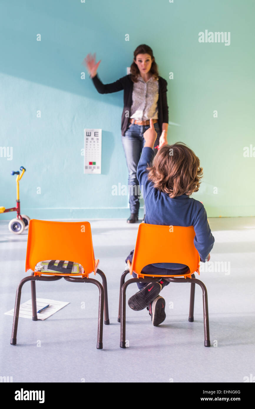 Medical check-up performed by a pediatric nurse of MCW in infant school ...